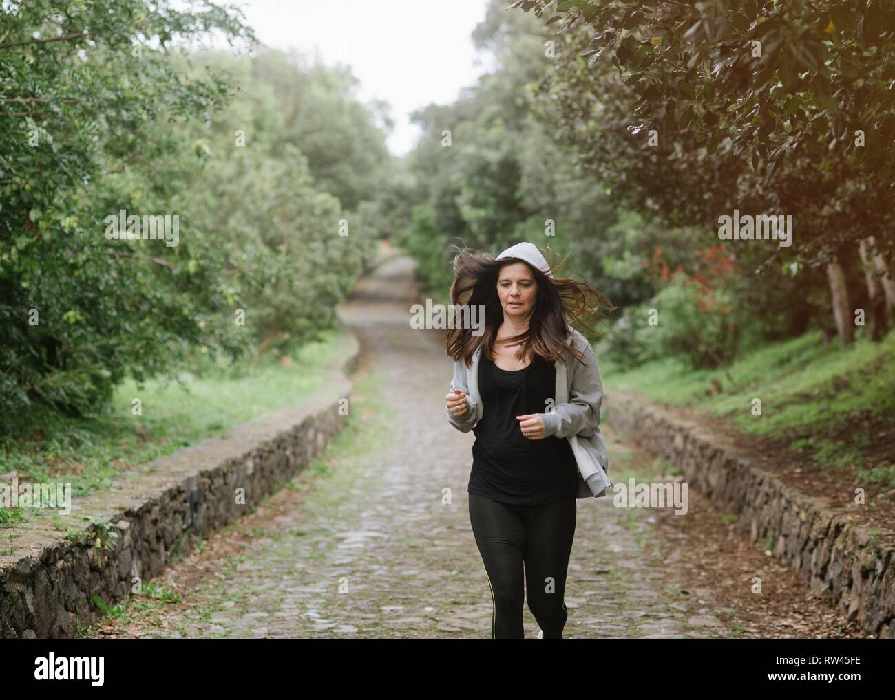 Positive woman running in hi-res stock photography and images - Alamy