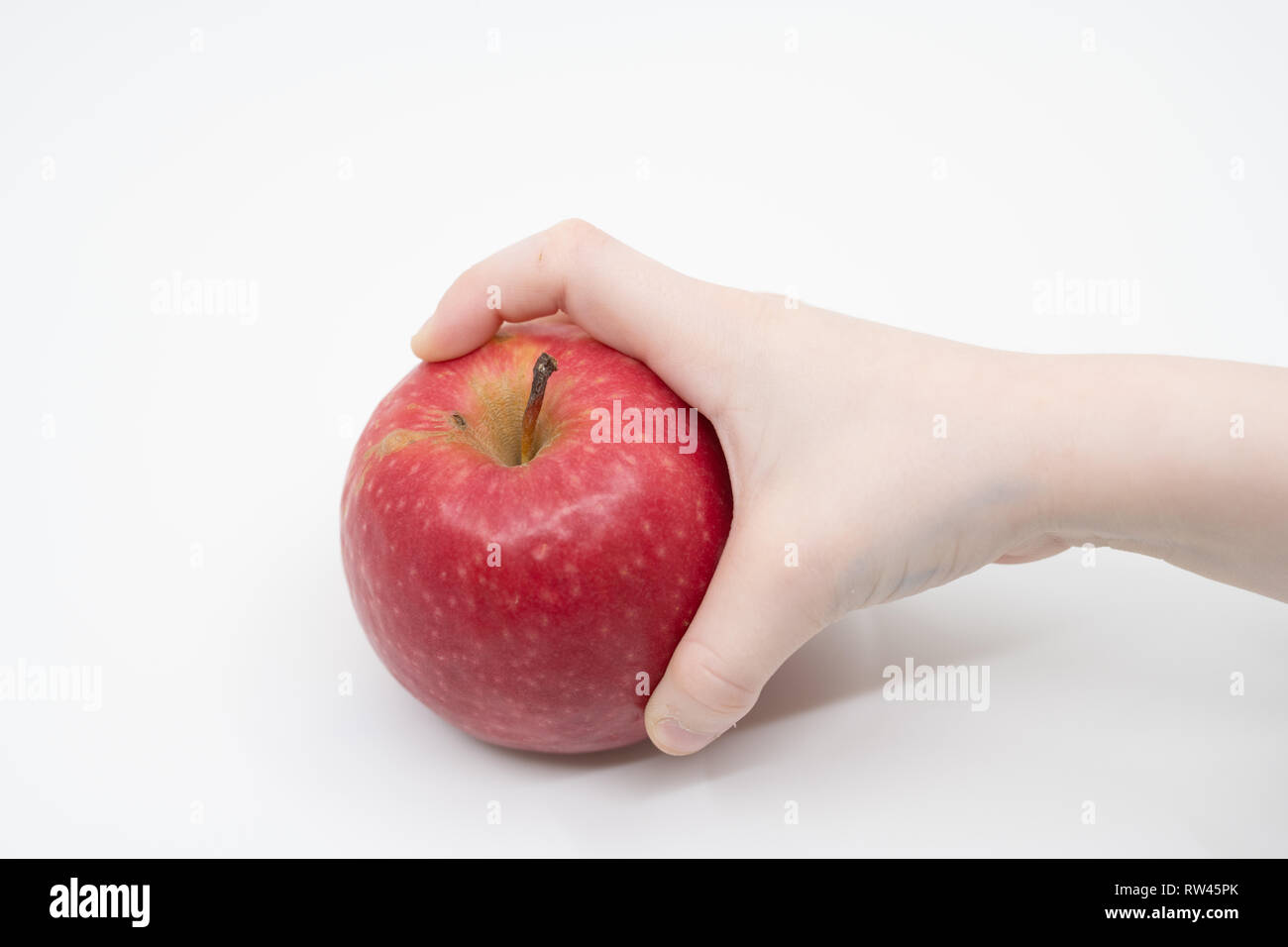 Grabbing an apple hi-res stock photography and images - Alamy