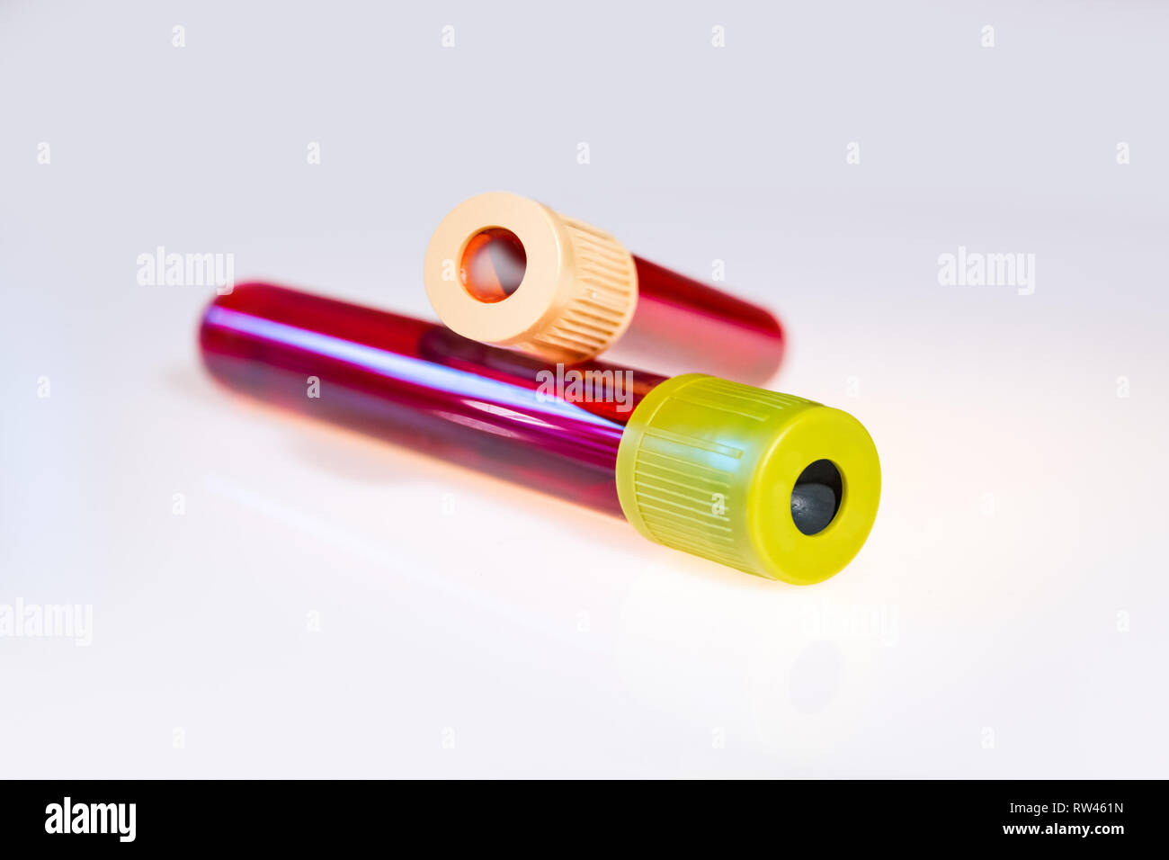 Two blood test tubes isolated on white background Stock Photo - Alamy