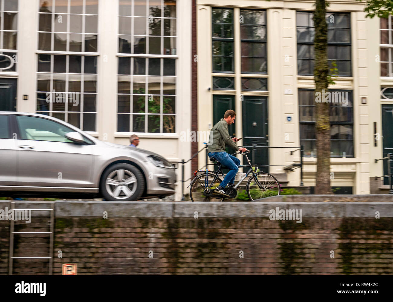 Bicycle riding urban amsterdam hi-res stock photography and images - Alamy