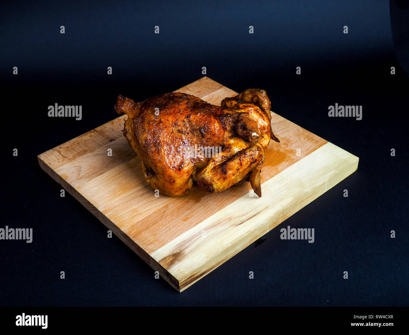 fried chicken entirely on a wooden stand alone Stock Photo - Alamy