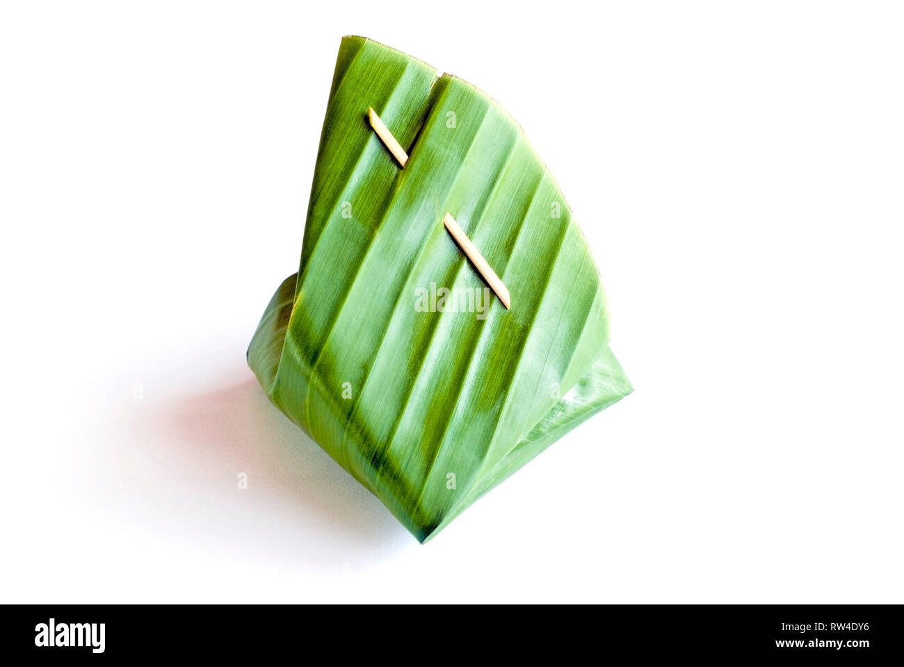 Sweet sticky rice with Thai custard in the banana leaf wrapped Stock ...