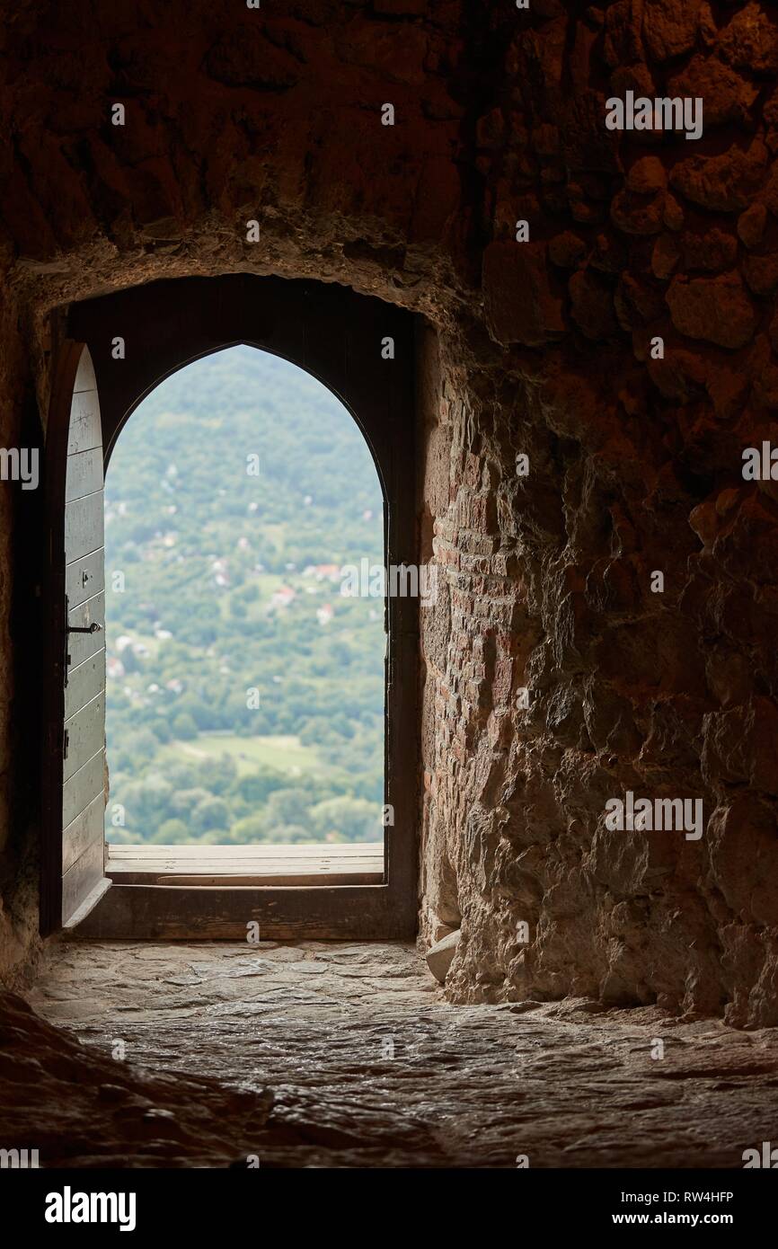 Passage of an old castle, open door Stock Photo - Alamy