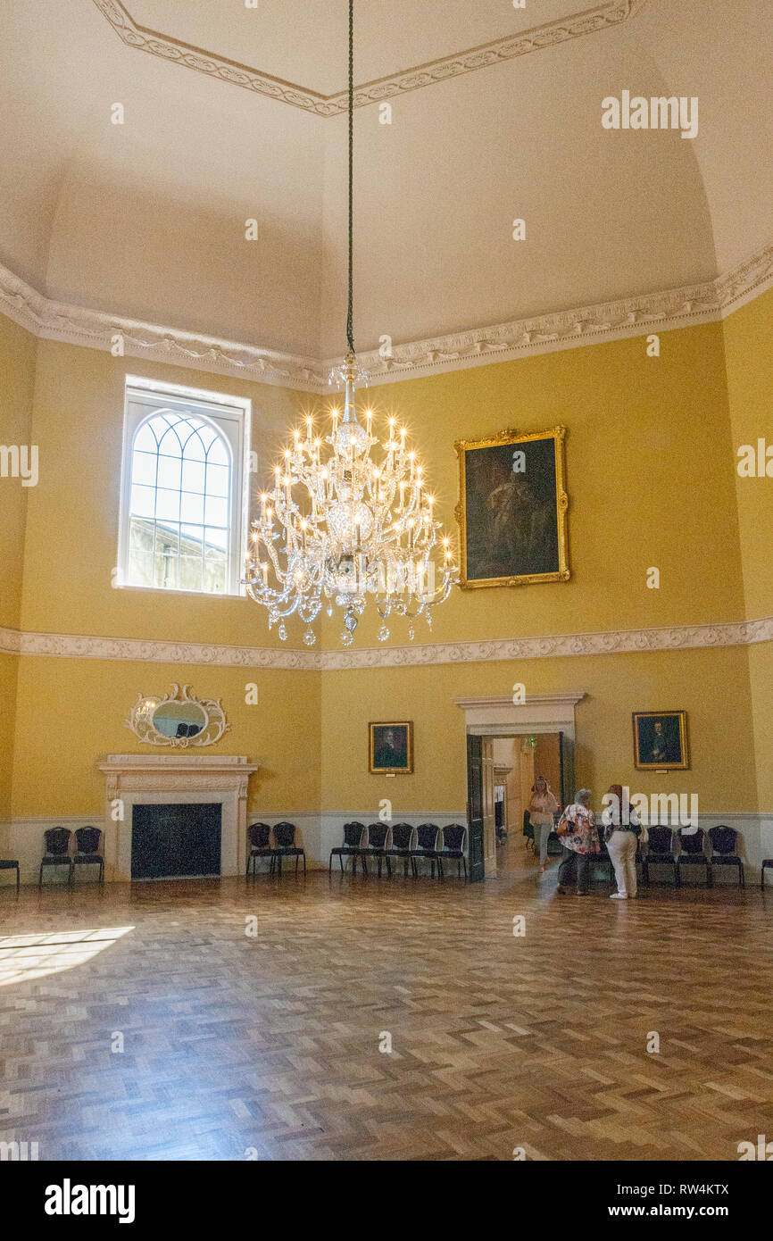 A magnificent glass chandelier and polished floor in the Octagon Room ...
