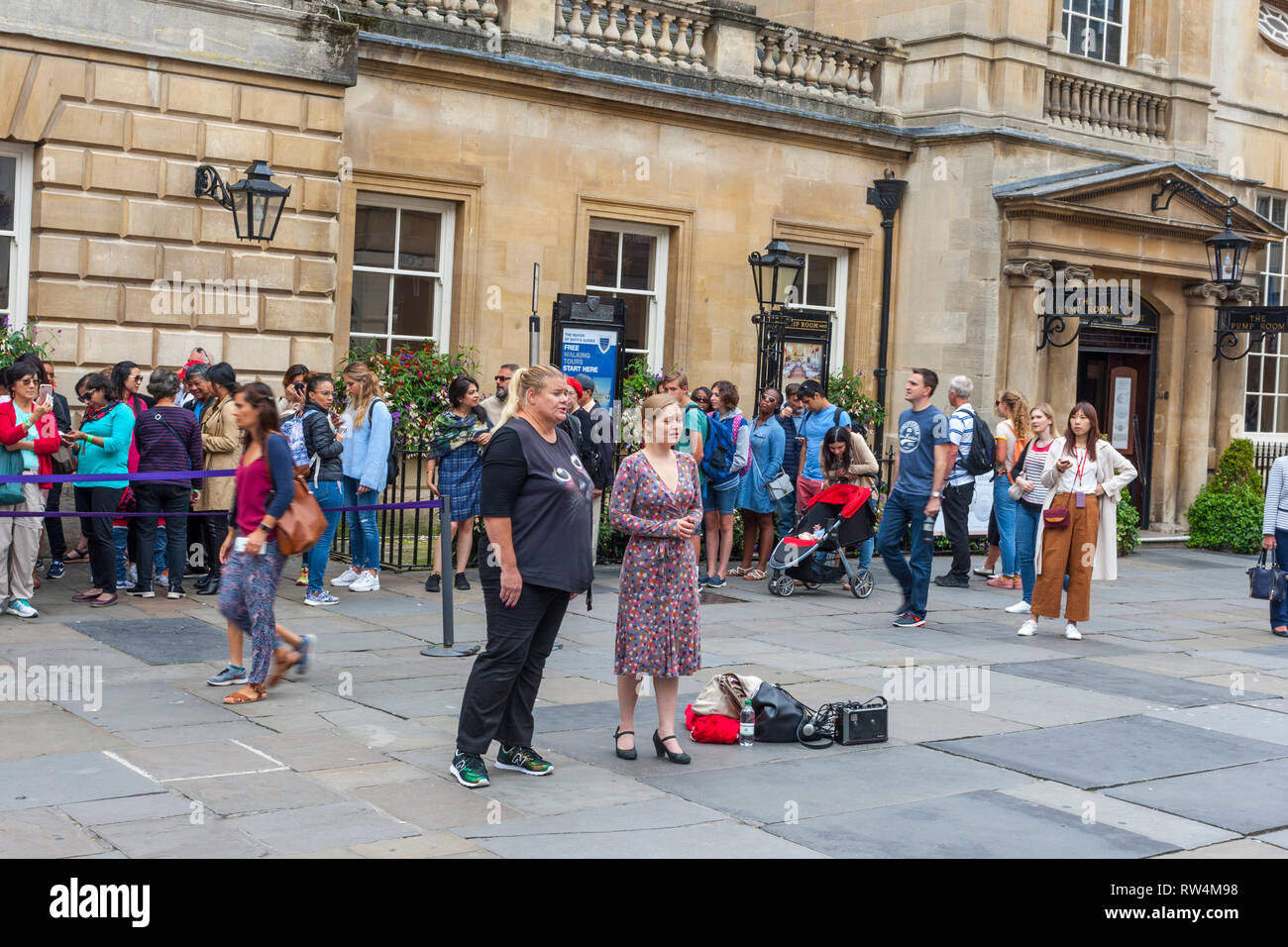 Opera singer buskers outside the Pump Rooms in Bath, N.E. Somerset ...
