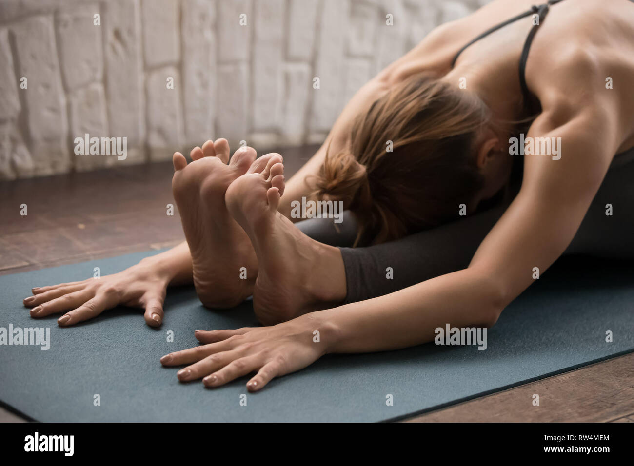 Seated Forward Bend Pose High Resolution Stock Photography and Images ...