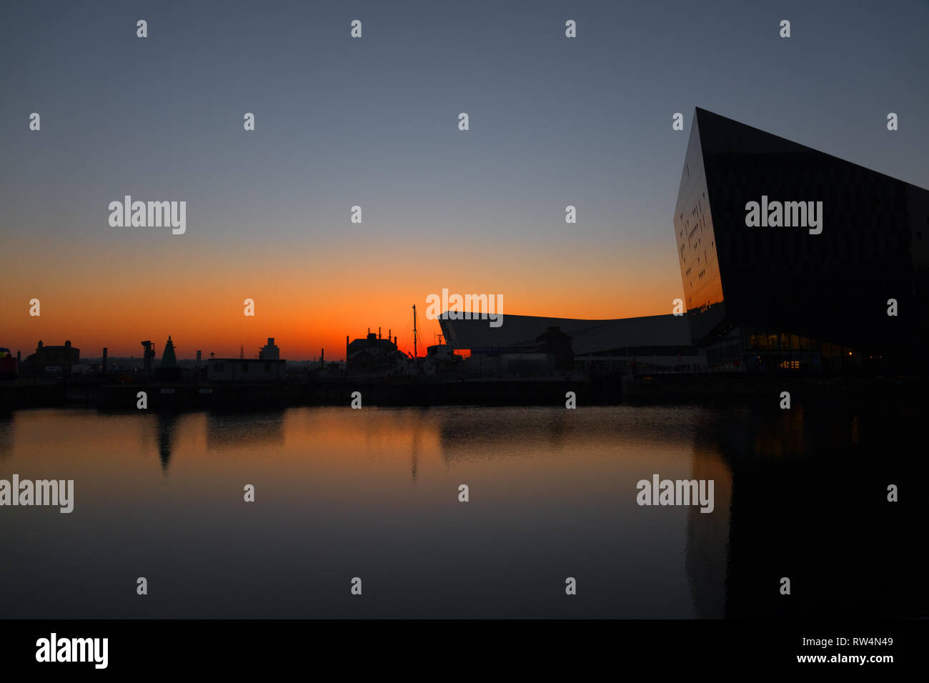 Liverpool waterfront buildings in silhouette against a sunset sky Stock ...
