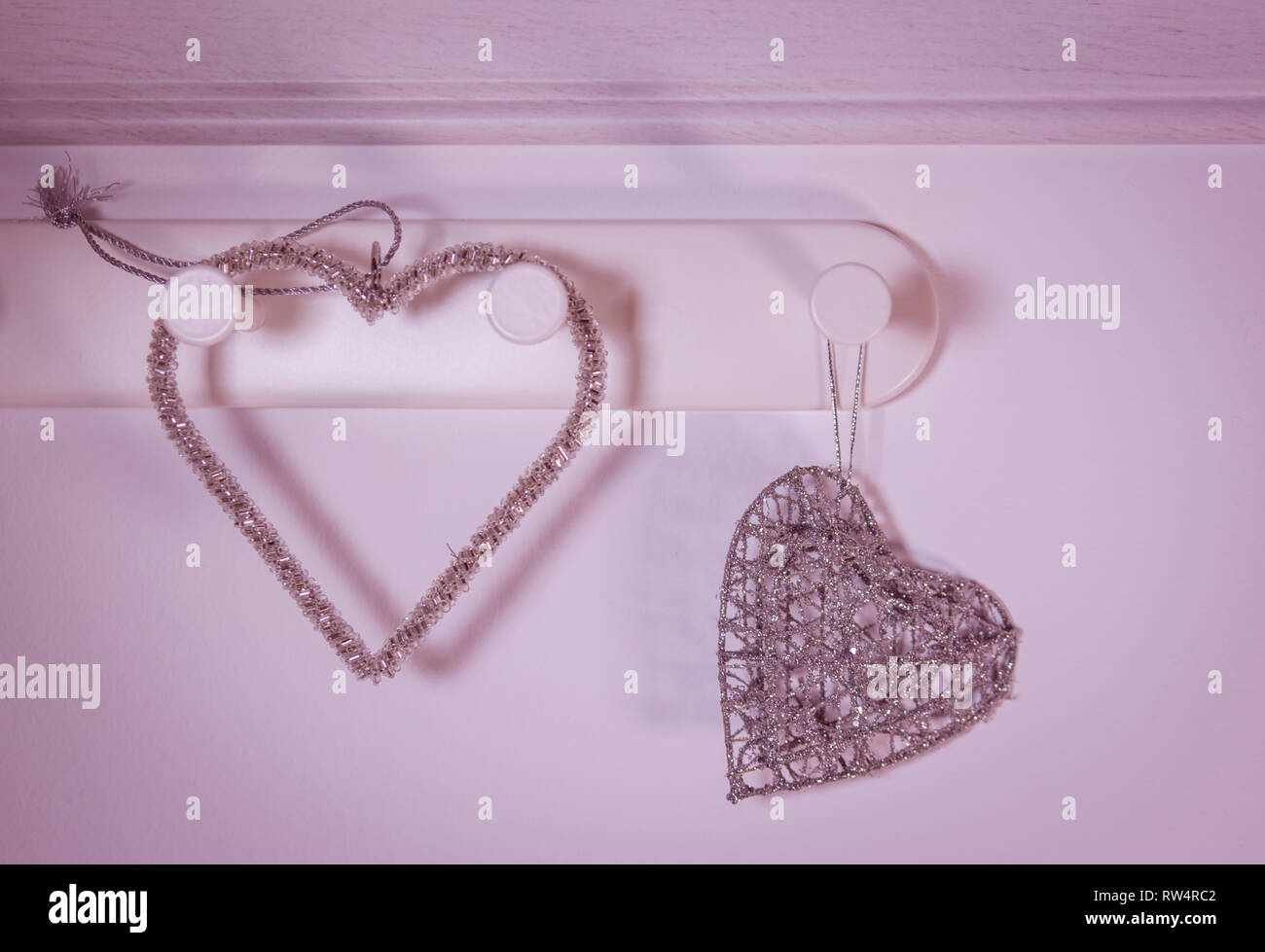 Heart shape hangers on red background. Valentines day concept Stock ...