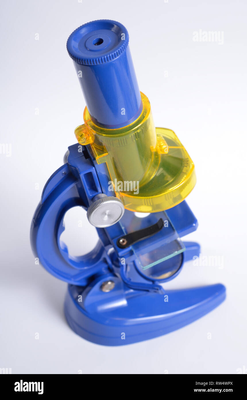 Blue plastic children's microscope on white background Stock Photo - Alamy