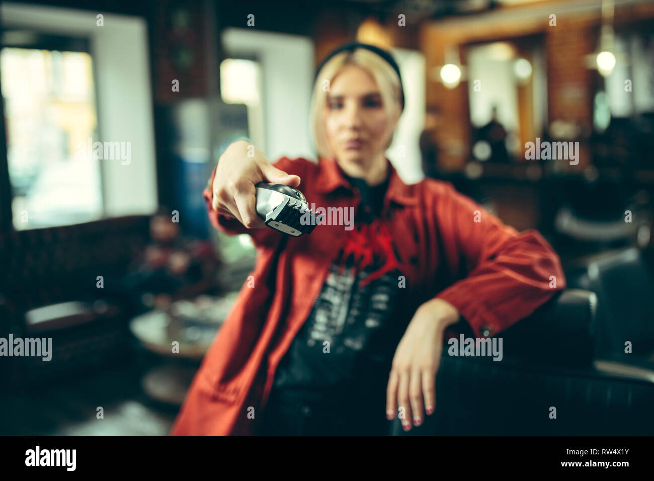 Barbershop. Female barber at salon. Gender equality. Woman in the male ...