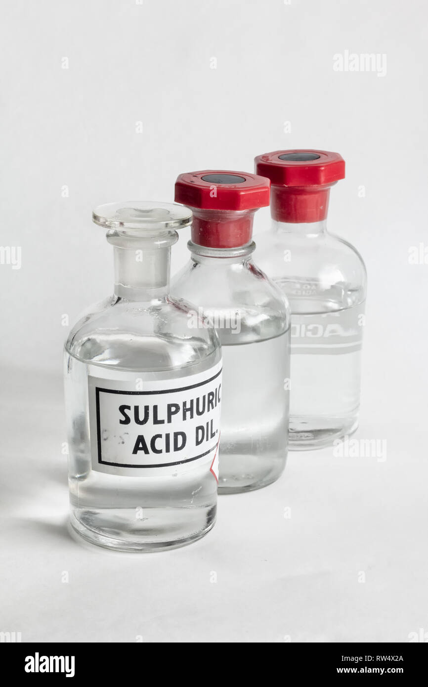 Reagent bottles of Sulphuric acid set against a white background Stock ...