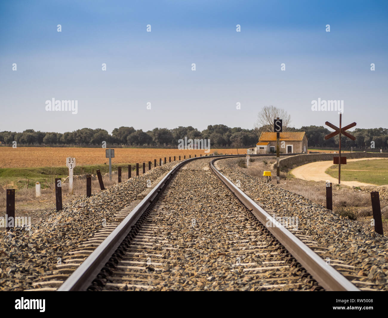 Rural landscape of a railway track and a small railway station Stock ...