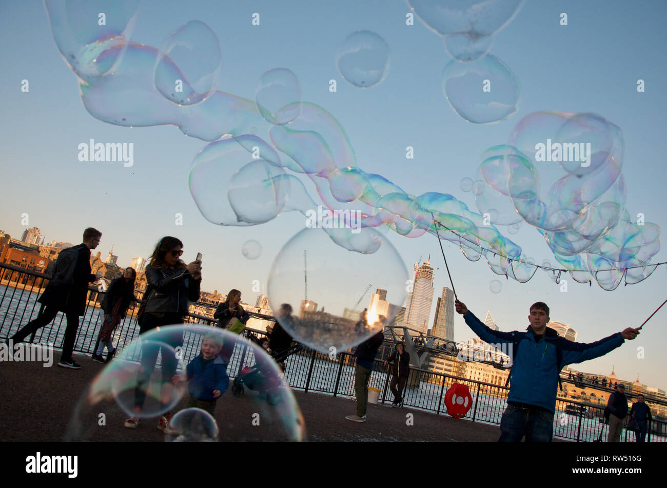 Bubbles floating urban hi-res stock photography and images - Alamy