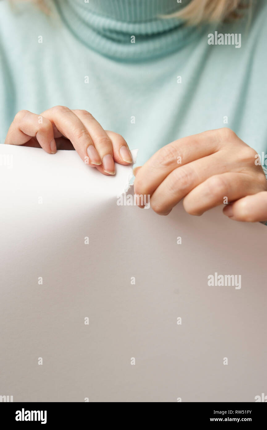 Ripping paper in half hi-res stock photography and images - Alamy