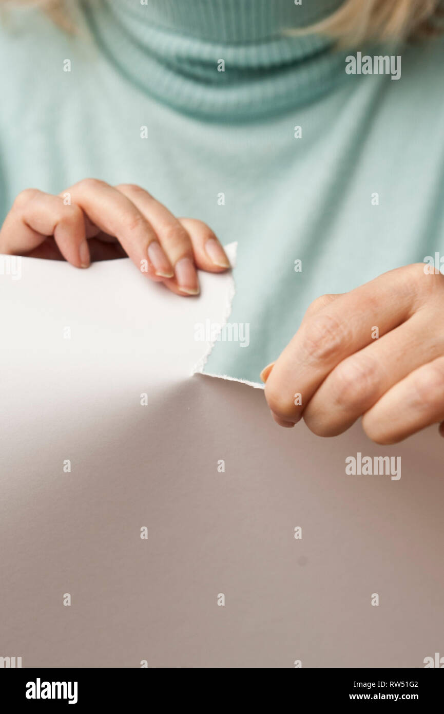 Ripping paper hi-res stock photography and images - Alamy