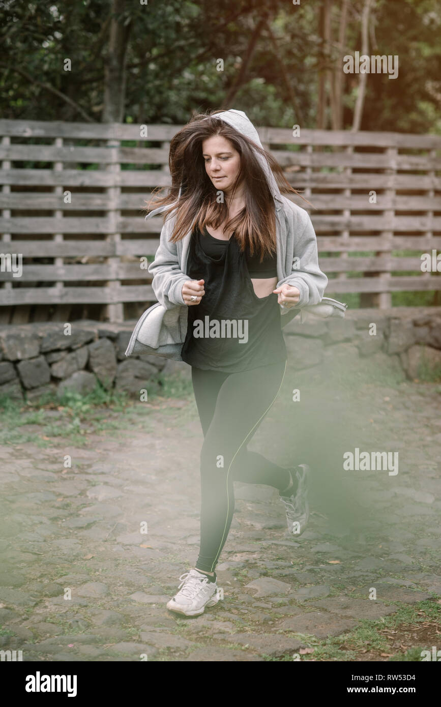 Positive woman running in hi-res stock photography and images - Alamy
