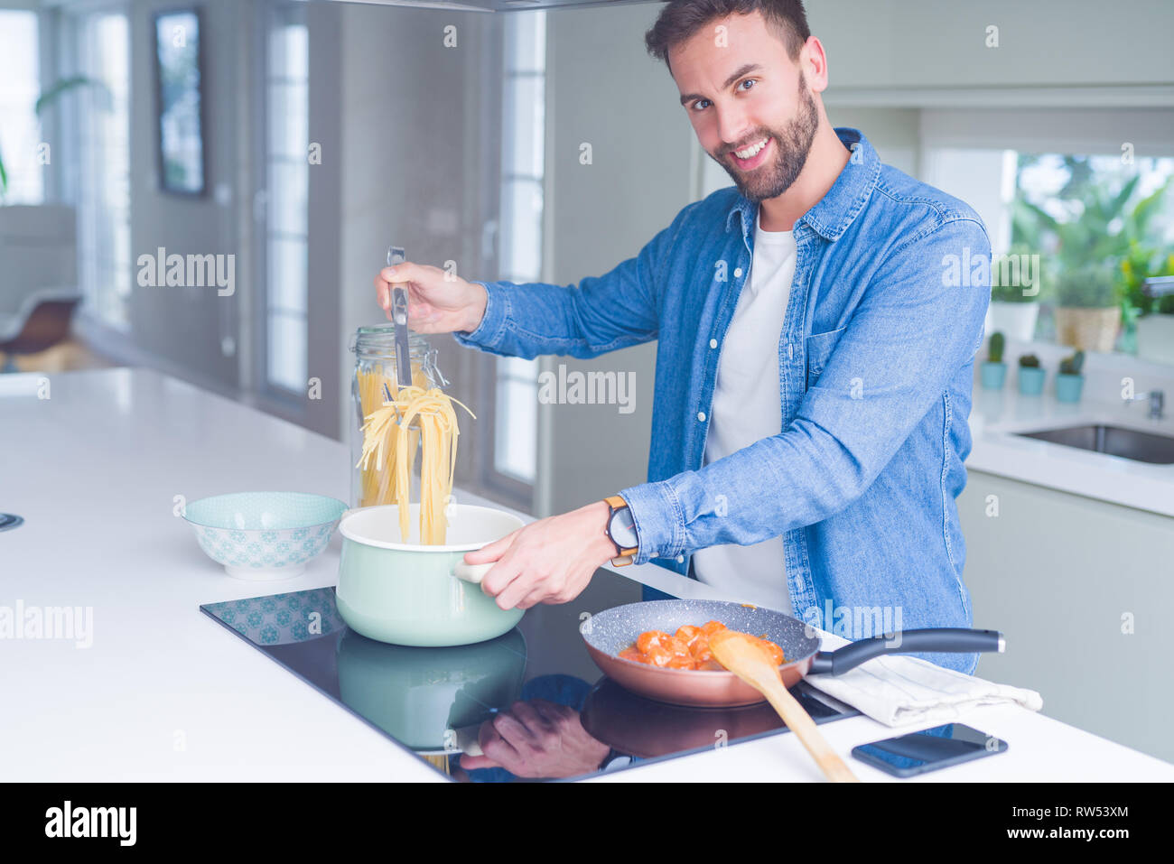 Hispanic boy eating pasta hi-res stock photography and images - Alamy