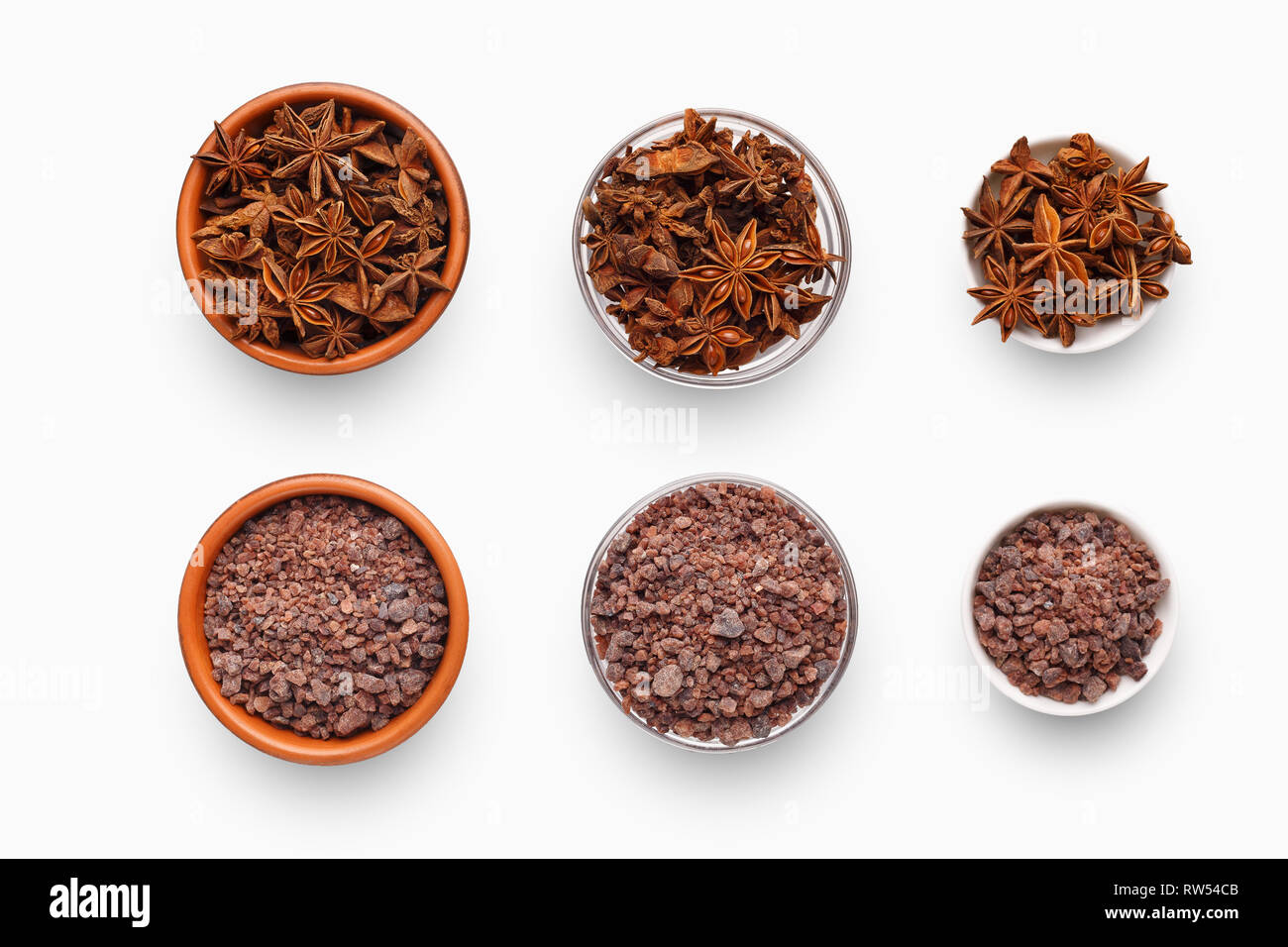 Different sized bowls with anise and black Indian salt on white Stock ...