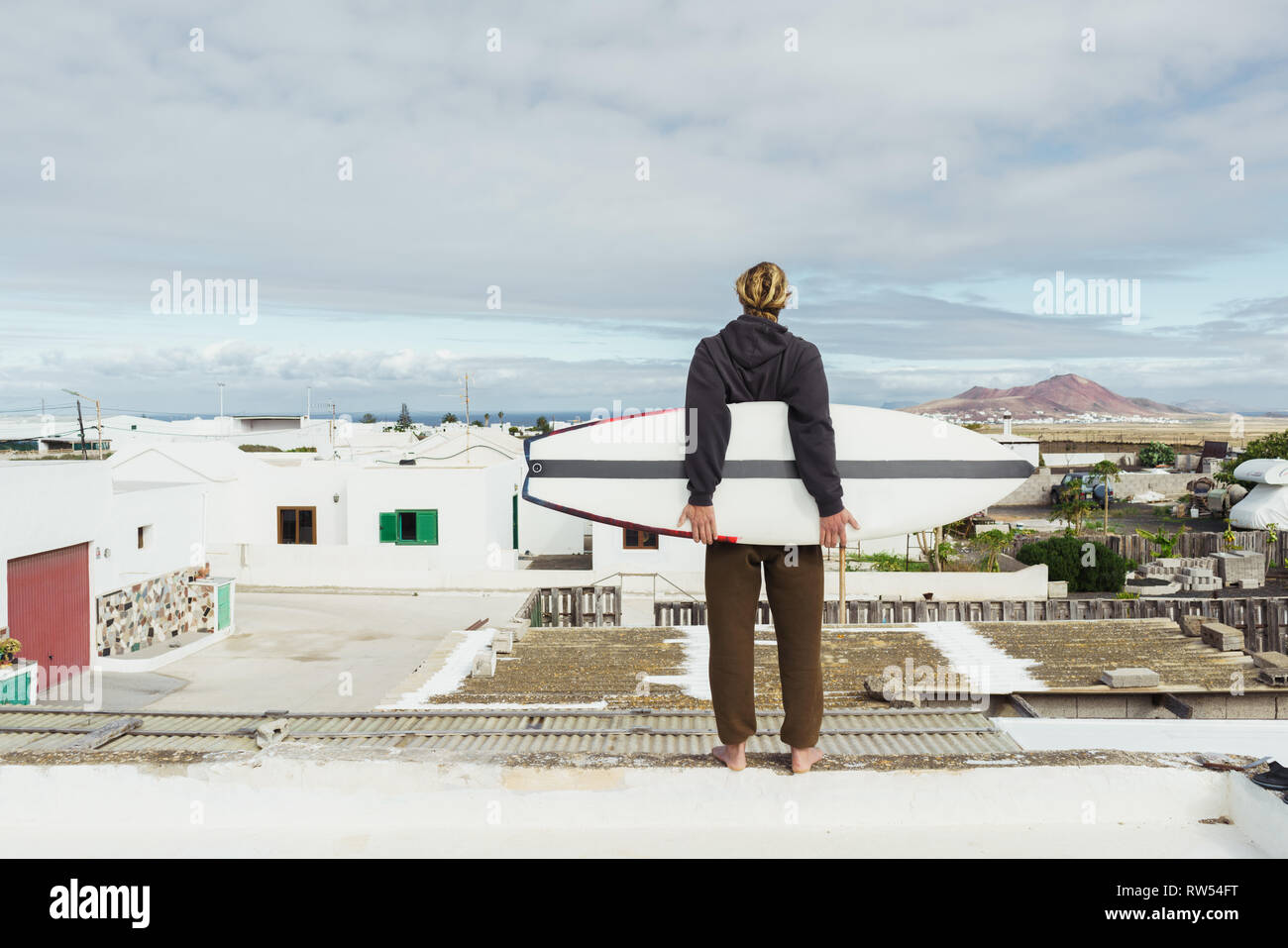Side view of slim female in swimsuit and flippers swimming underwater ...