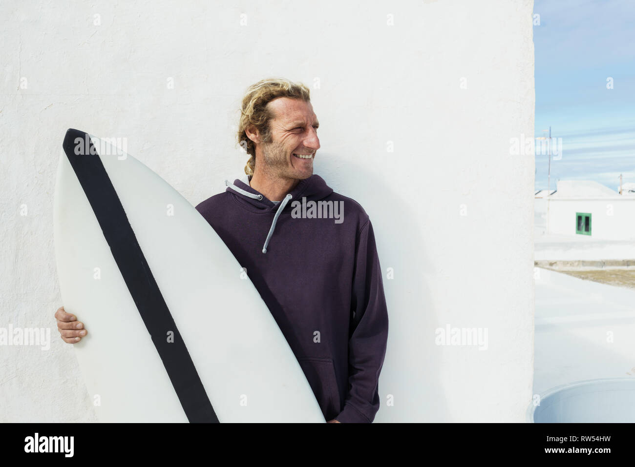 Smiling by the surf hi-res stock photography and images - Alamy