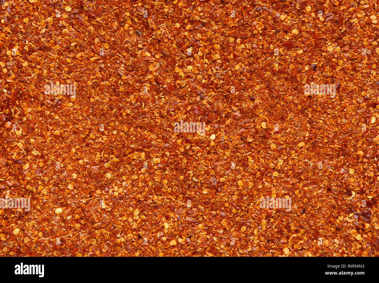 Crushed dry red hot chili pepper texture Stock Photo - Alamy