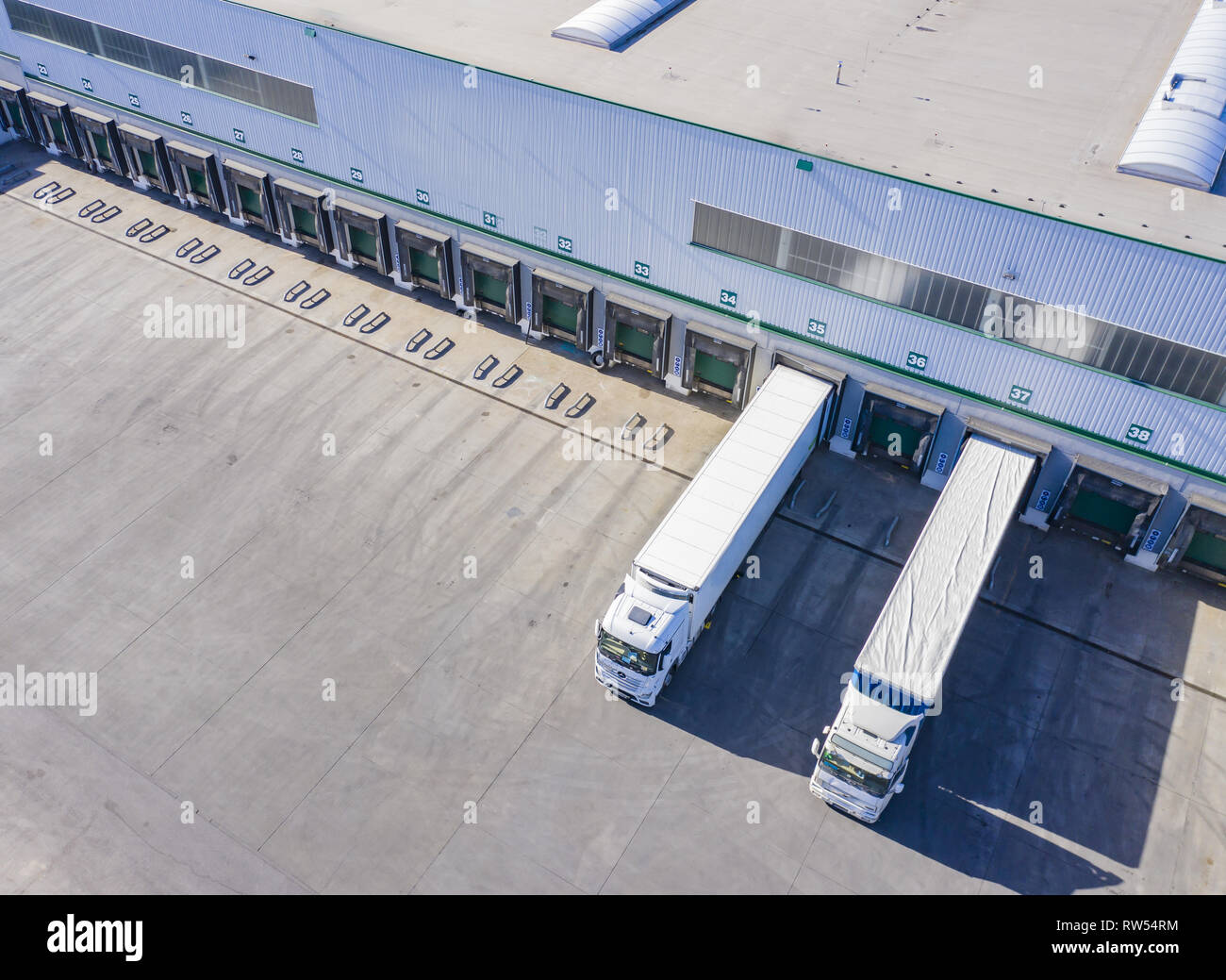 Top view at a Big distribution warehouse with gates for loads and ...