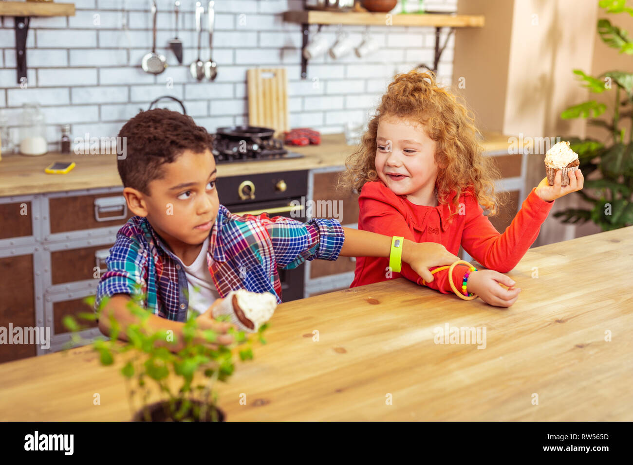 Cheerful children having dessert after eating healthy dinner Stock ...