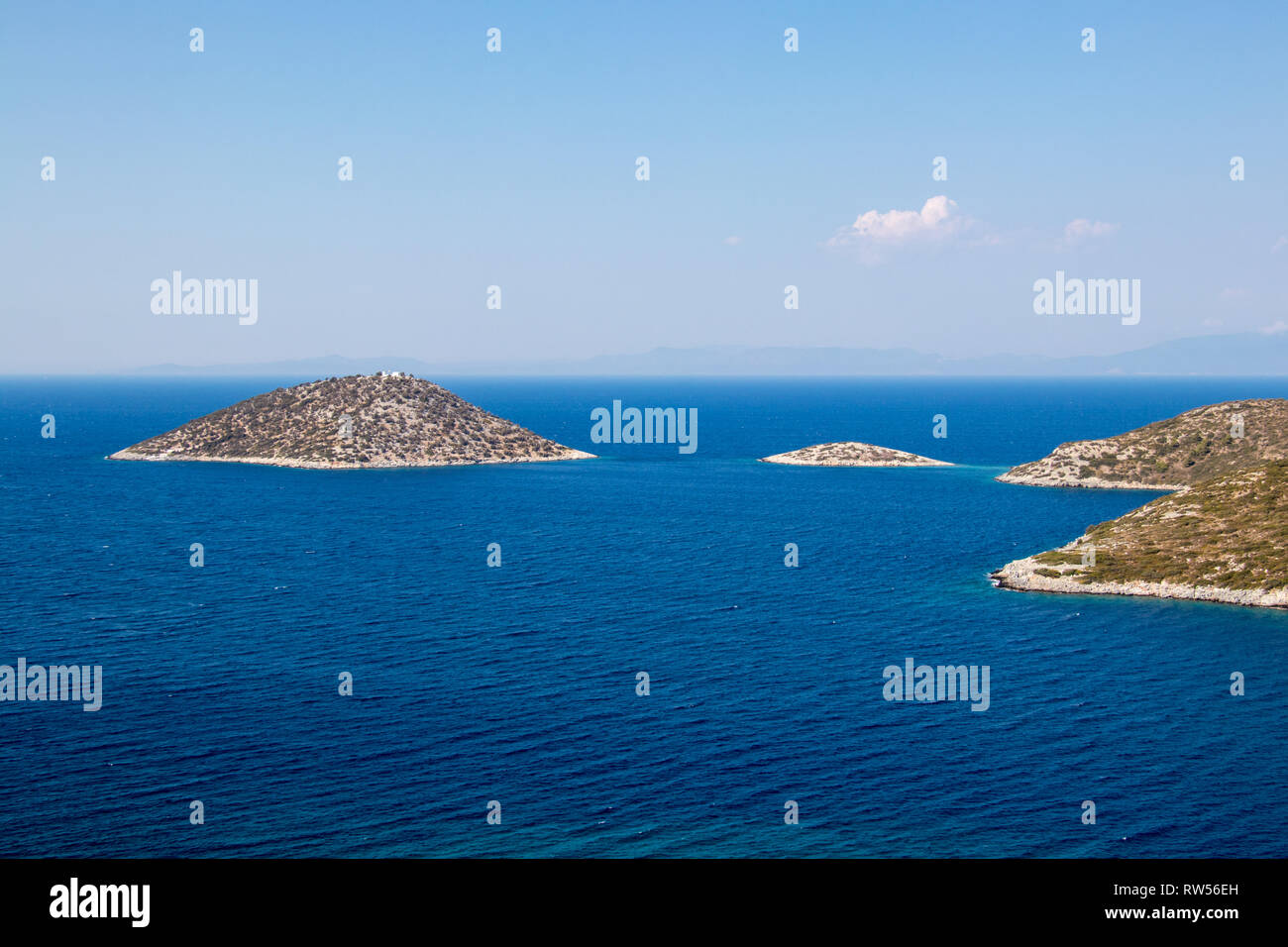 two micro island next to Samos island Stock Photo - Alamy