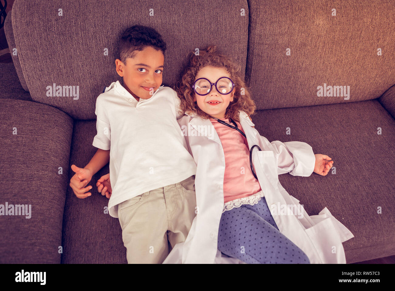 Positive delighted kids looking straight at camera Stock Photo - Alamy