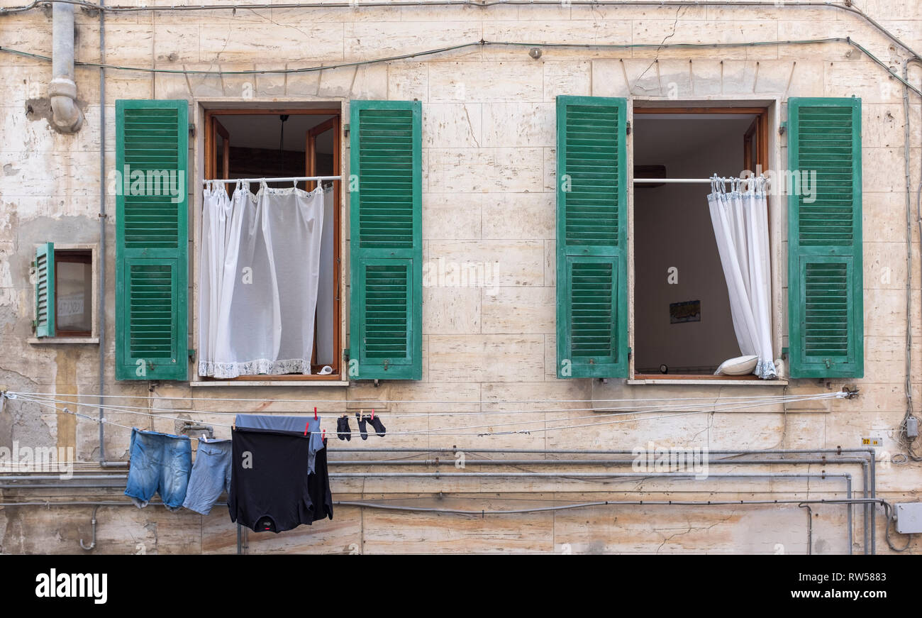 Italian windows with green painted shutters Stock Photo - Alamy