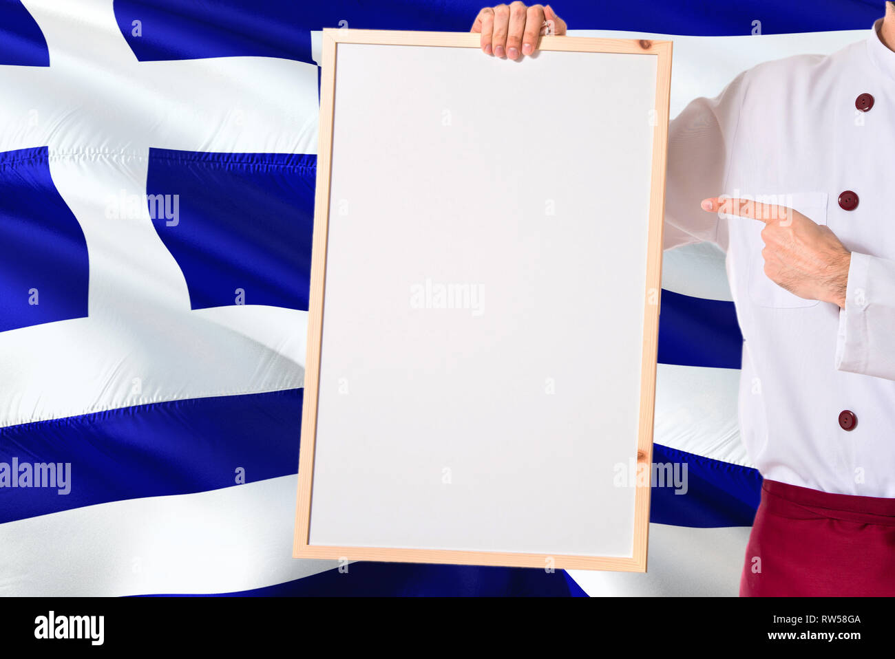 Greek Chef holding blank whiteboard menu on Greece flag background ...