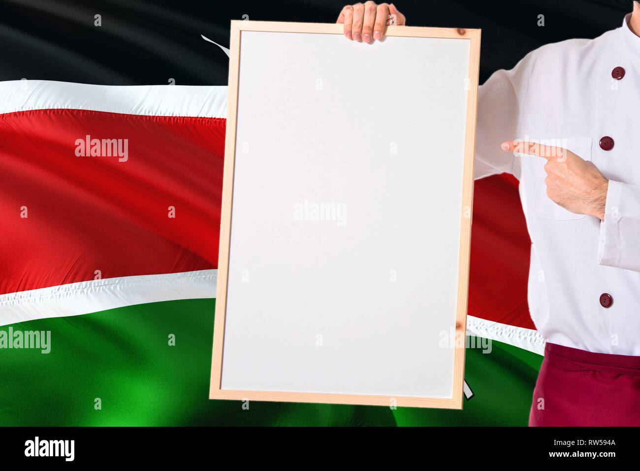 Kenyan Chef holding blank whiteboard menu on Kenya flag background ...