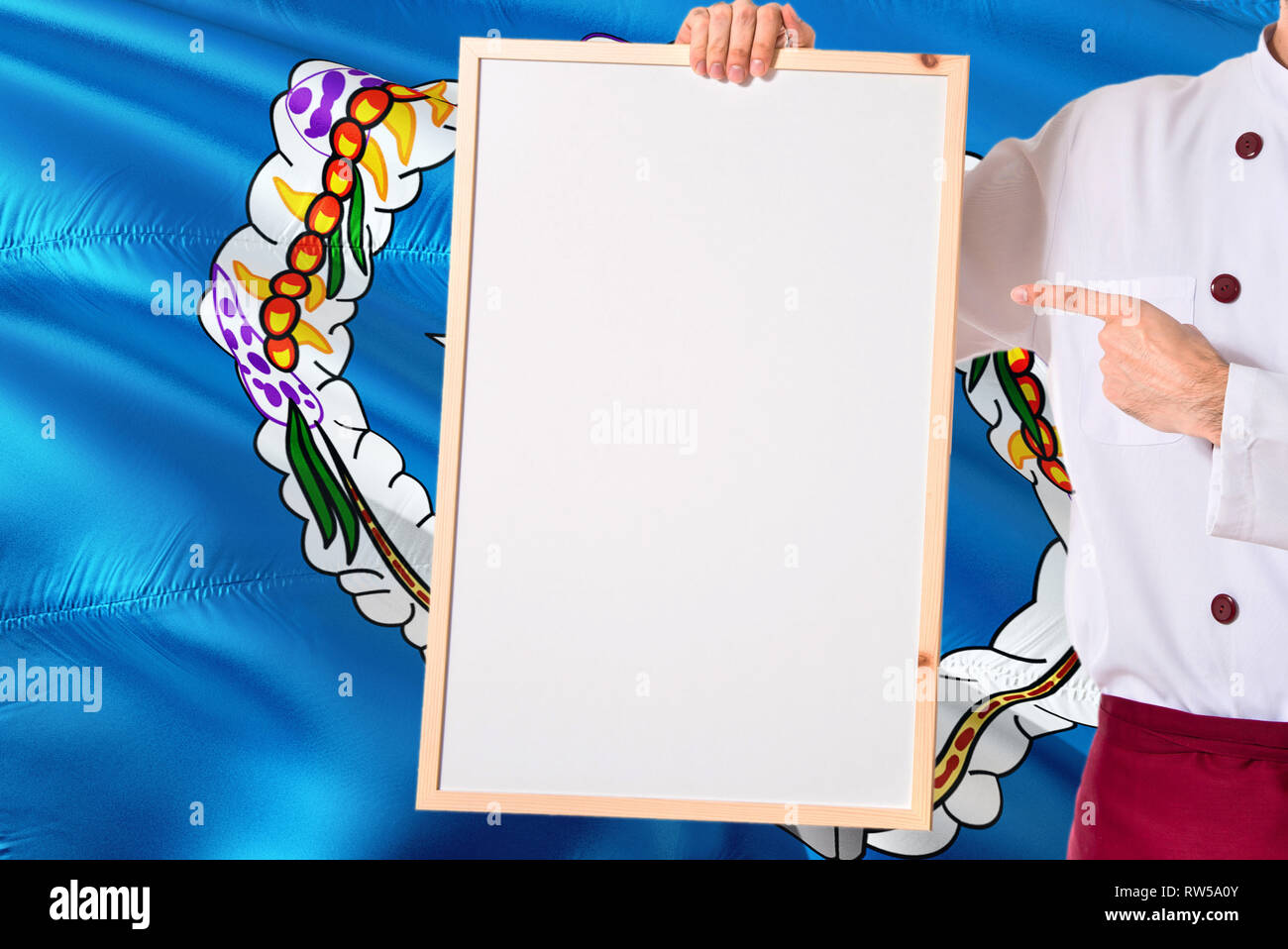 Chef holding blank whiteboard menu on Northern Mariana Islands flag ...