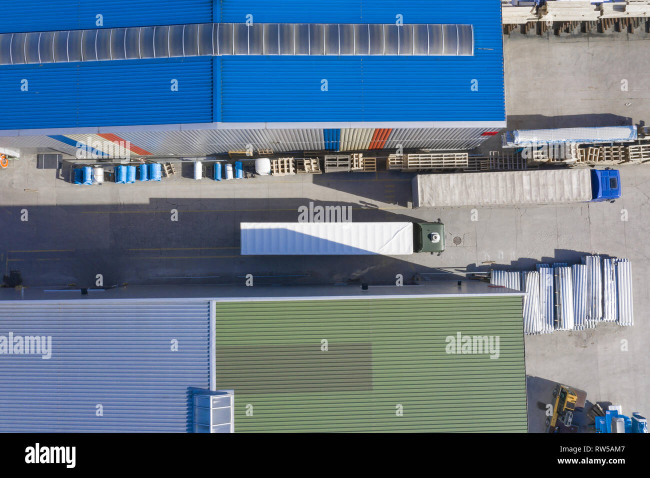 Aerial view, logistic warehouse, trucks ride near warehouse ramp Stock ...