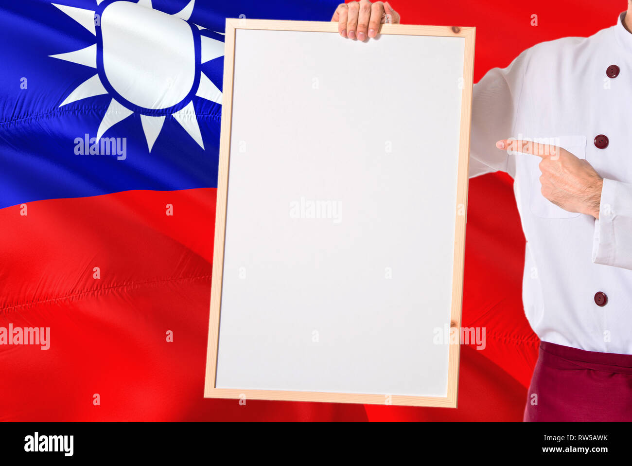 Taiwanese Chef holding blank whiteboard menu on Taiwan flag background ...