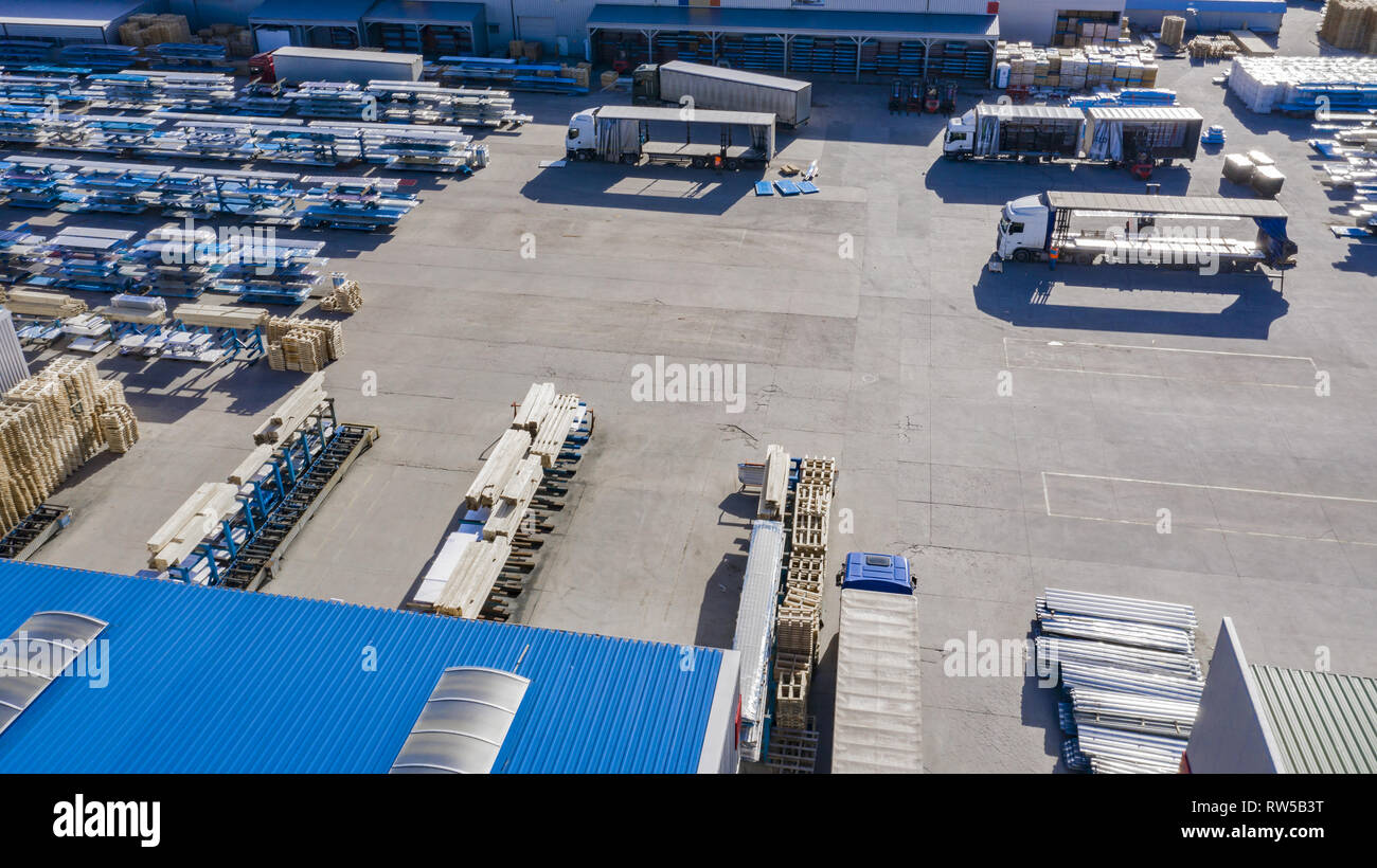 Logistics center. Trucks in warehouse distribution center. Aerial View ...