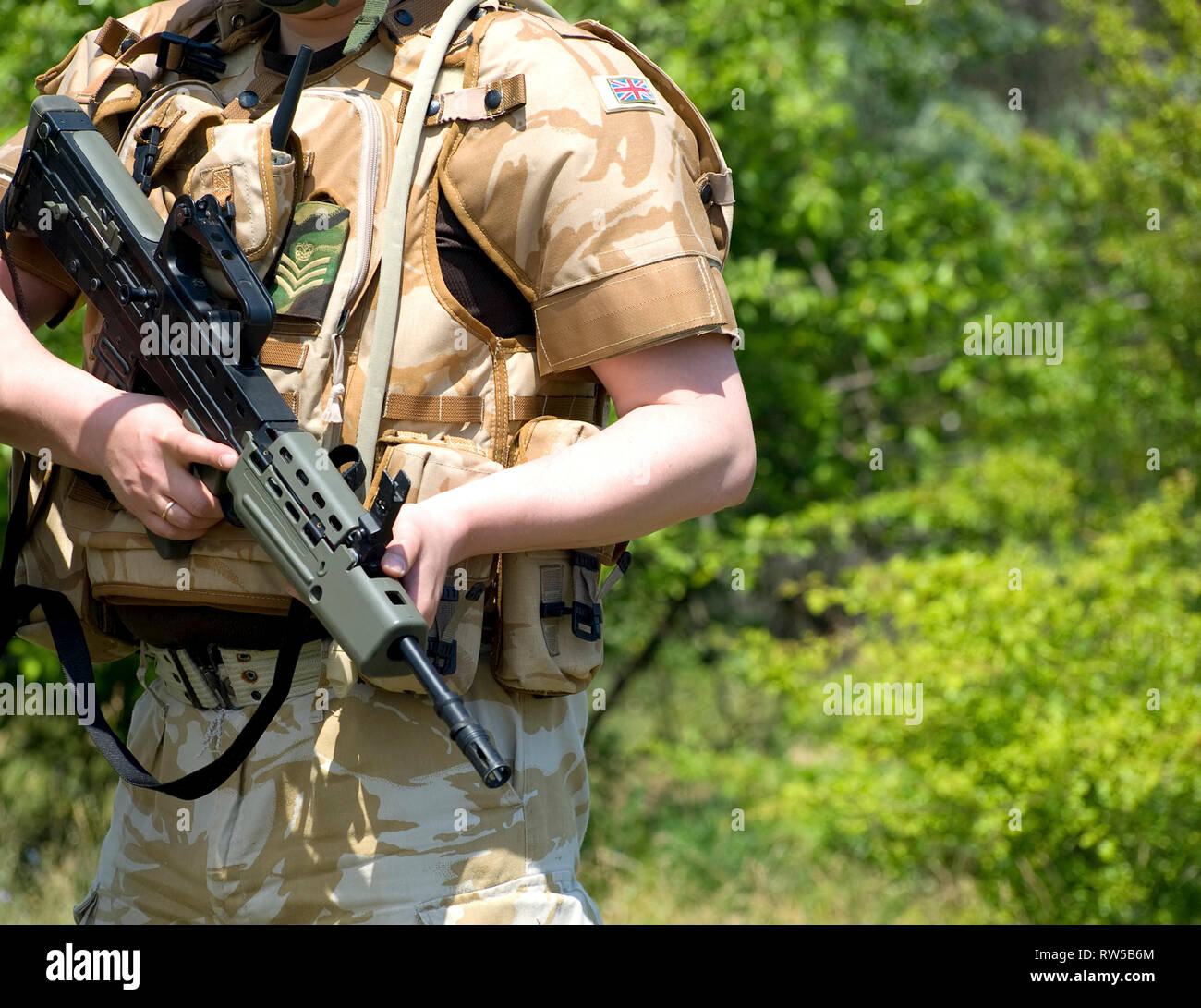 British Royal Commando in camouflage uniform holding his rifle Stock ...