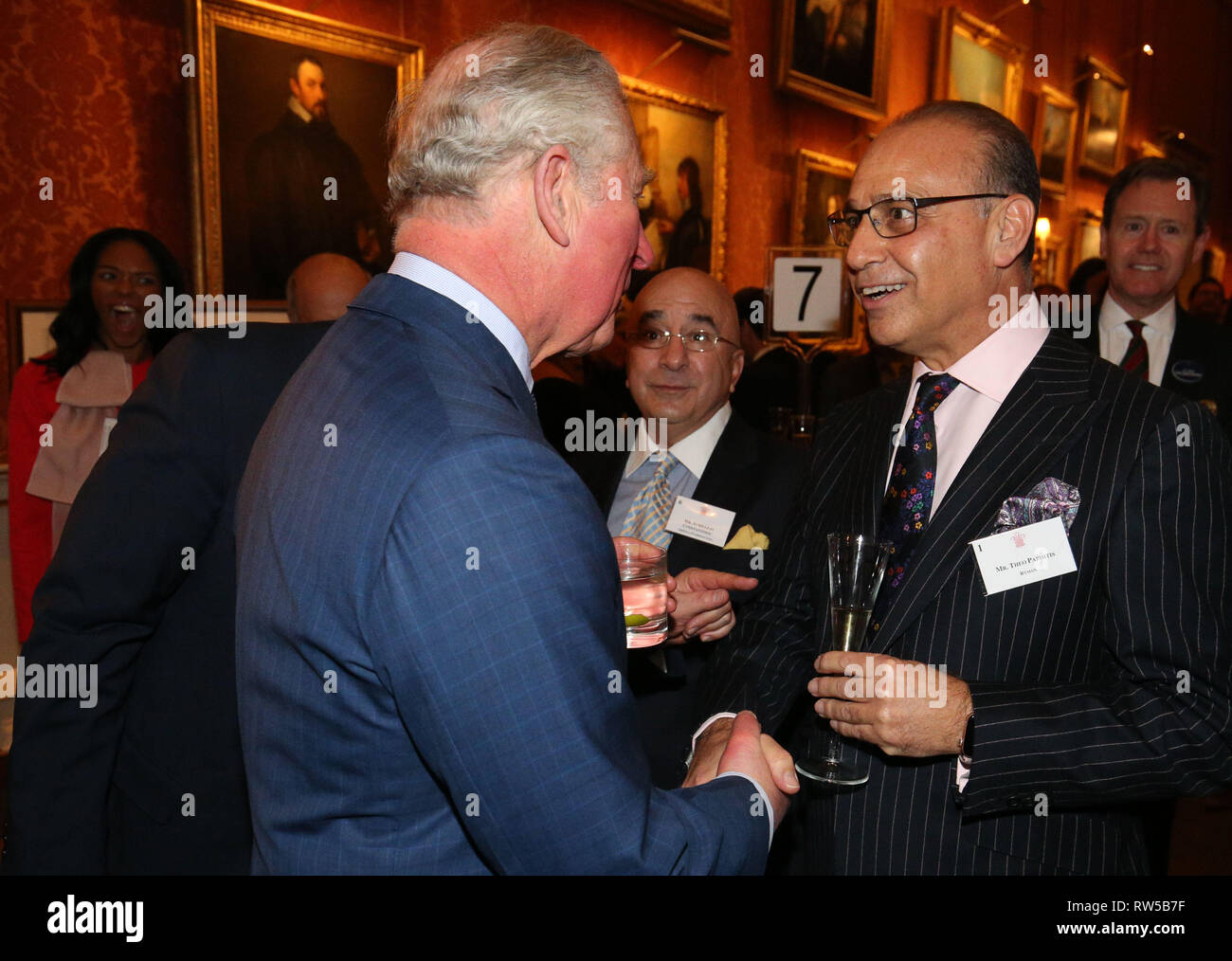 The Prince of Wales speaks to Theo Paphitis during a reception at ...