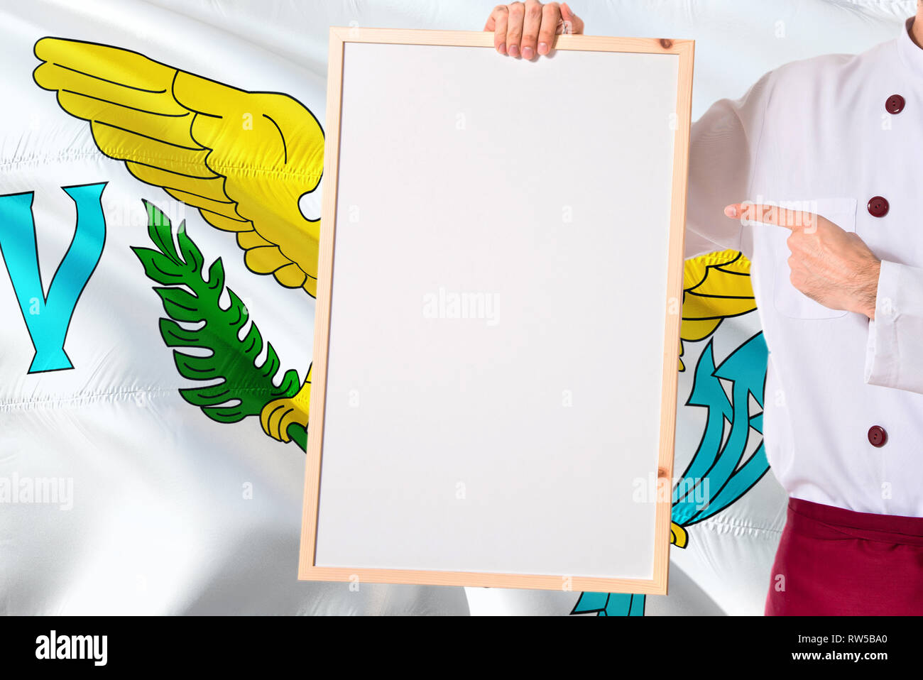 Chef holding blank whiteboard menu on United States Virgin Islands flag ...