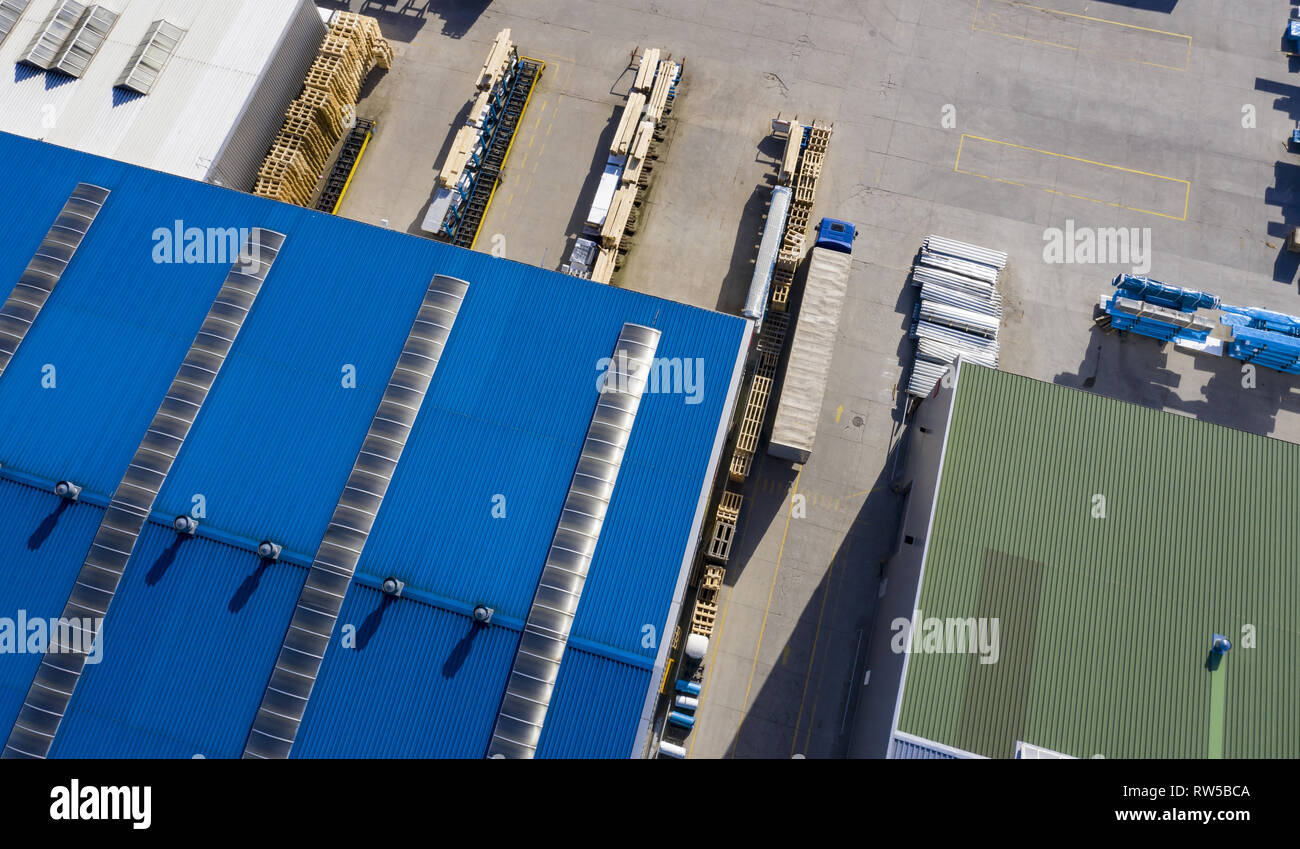 Logistics center. Trucks in warehouse distribution center. Aerial View ...