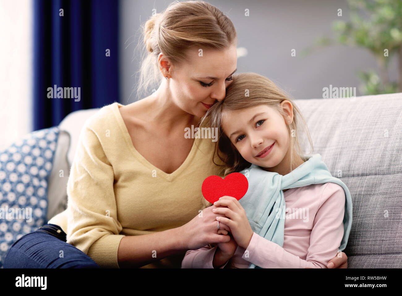 Beautiful mom and her daughter having fun at home Stock Photo - Alamy