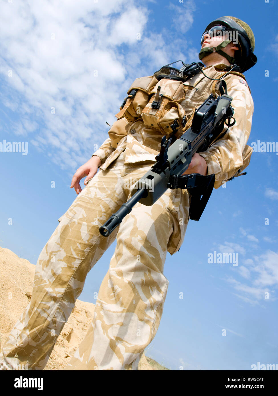 British Royal Commando in desert uniform holding his rifle Stock Photo ...