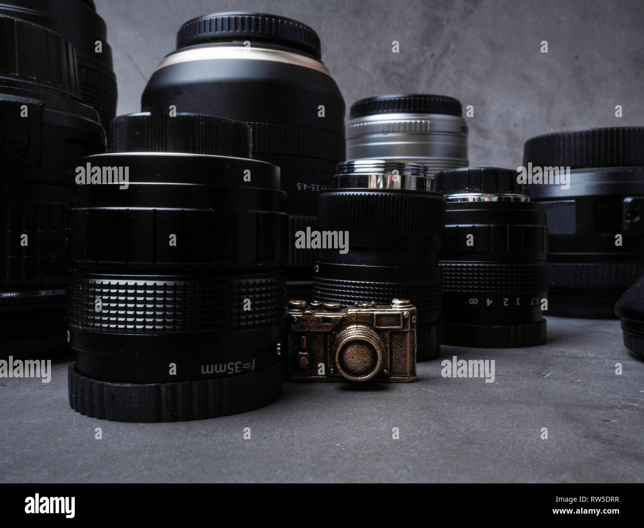 Professional camera lenses on a grey background with copy space, for a ...