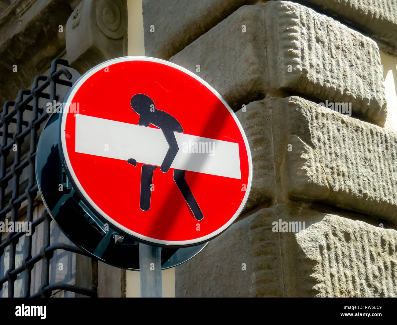 funny drive prohibited warning sign with man working hard carry Stock ...