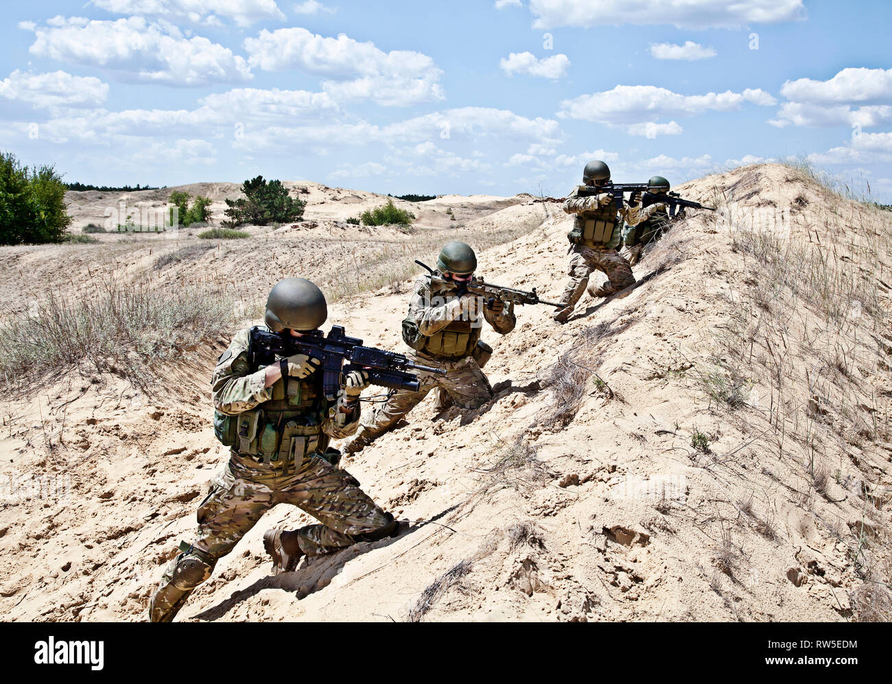 Squad of soldiers in the desert during the military operation Stock ...