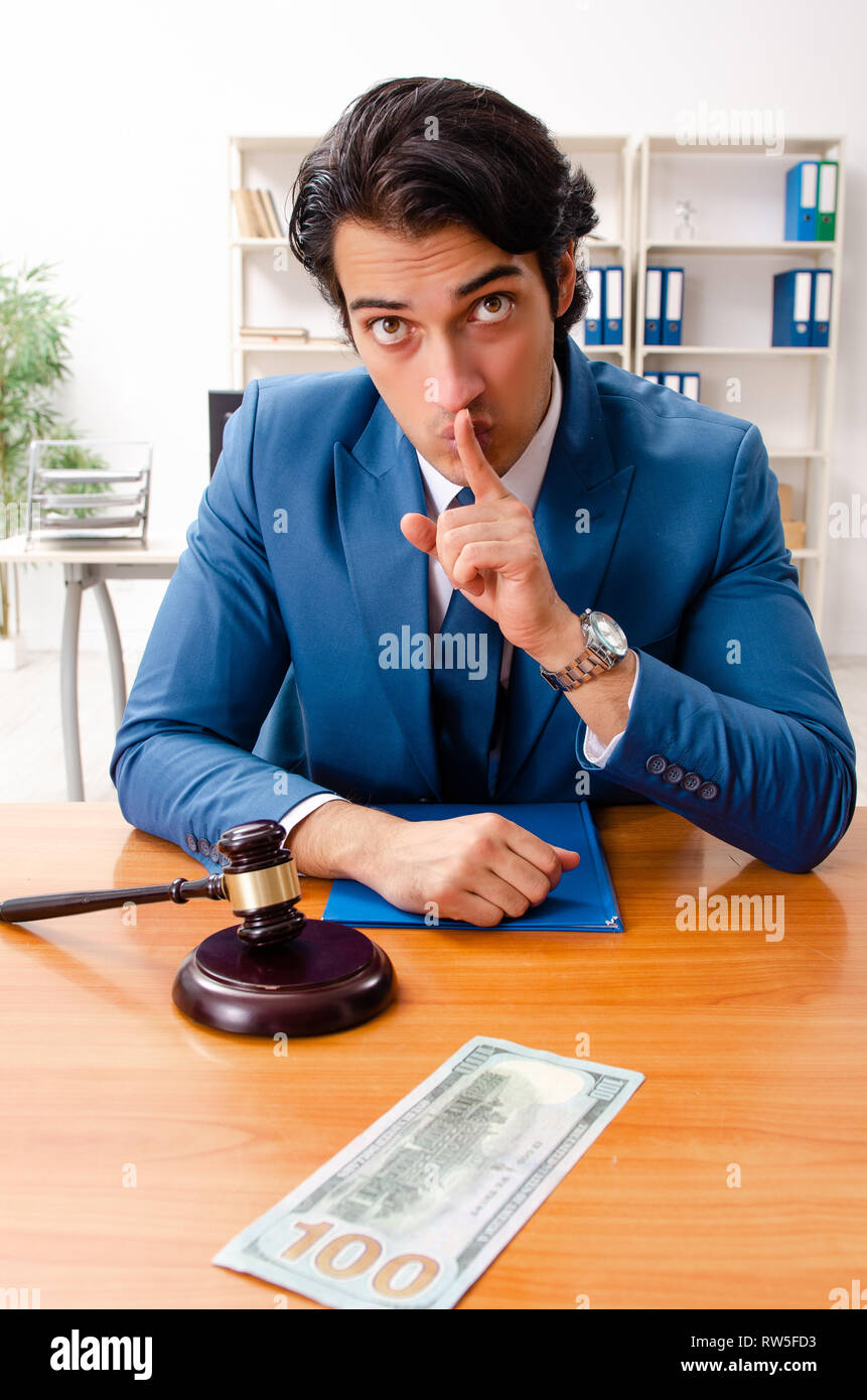 Young handsome judge sitting in courtroom Stock Photo - Alamy