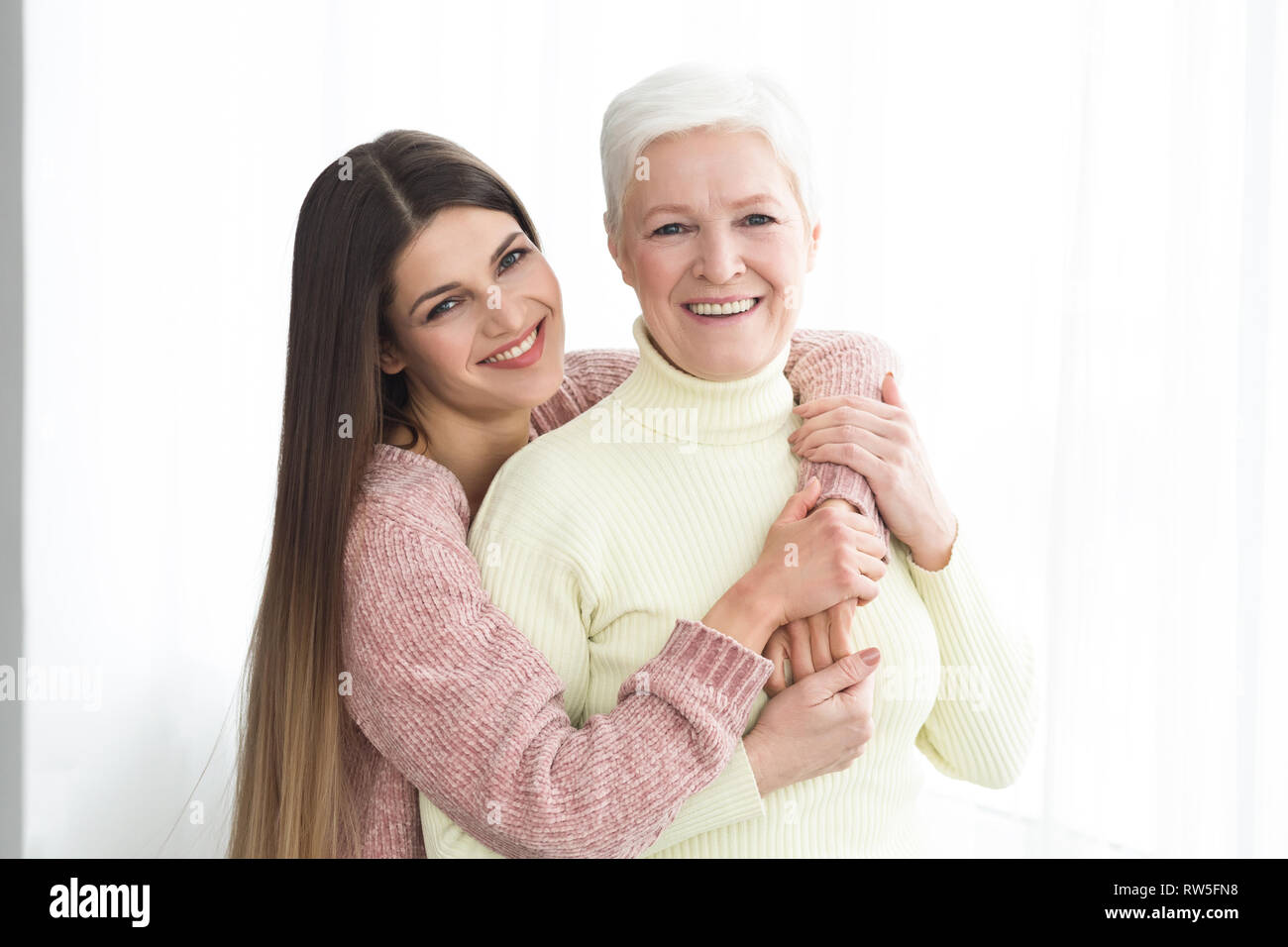 Mother Girl Hug Arm High Resolution Stock Photography and Images - Alamy