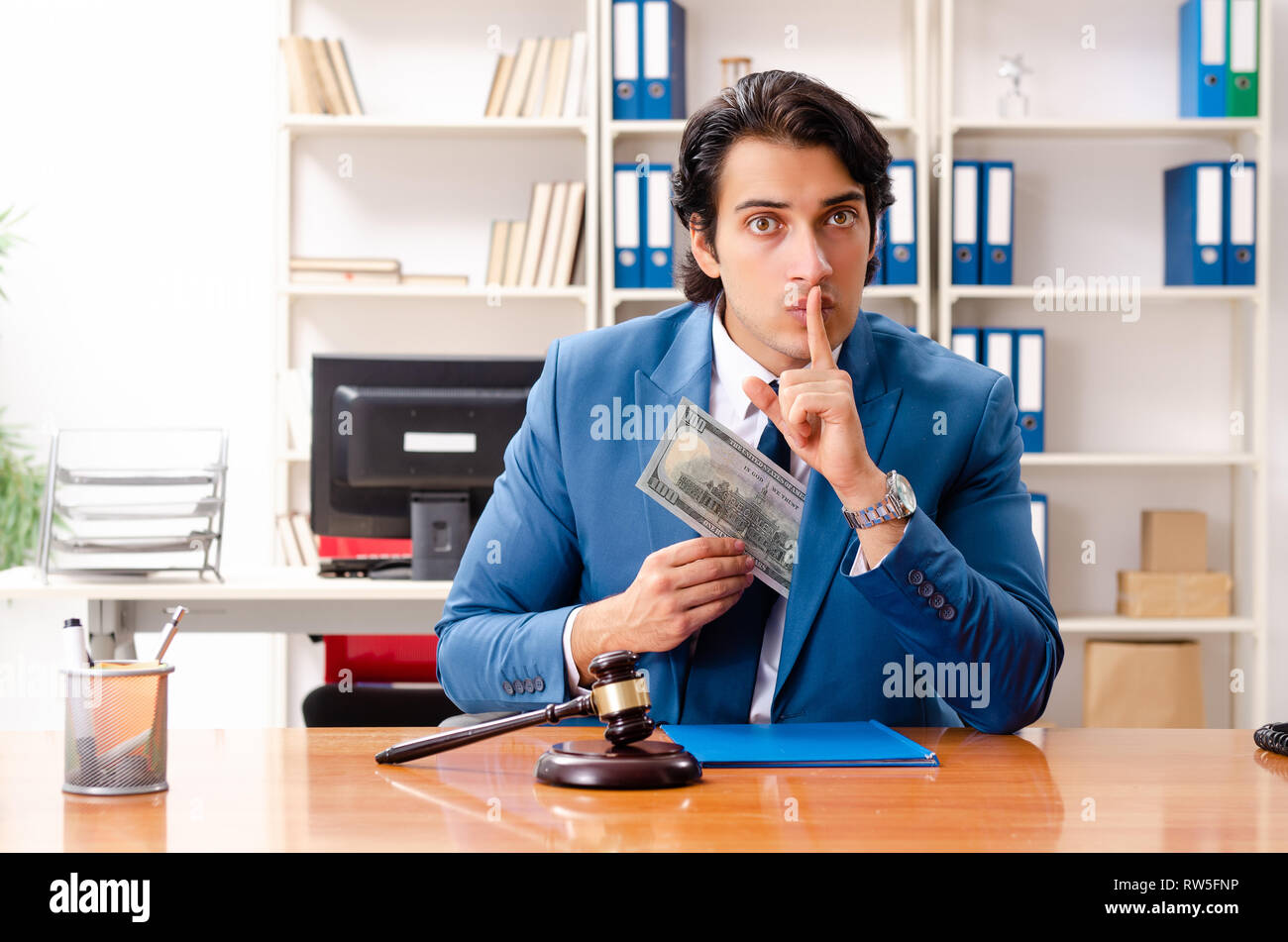 Young handsome judge sitting in courtroom Stock Photo - Alamy