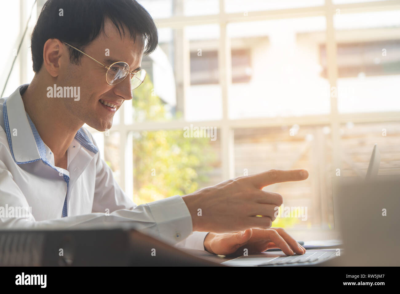 Business man pointing finger hi-res stock photography and images - Alamy