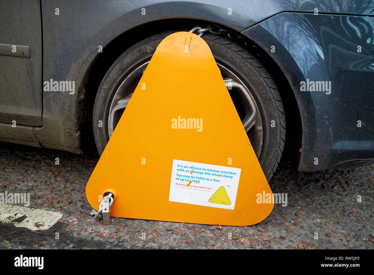 Yellow clamped wheel hi-res stock photography and images - Alamy